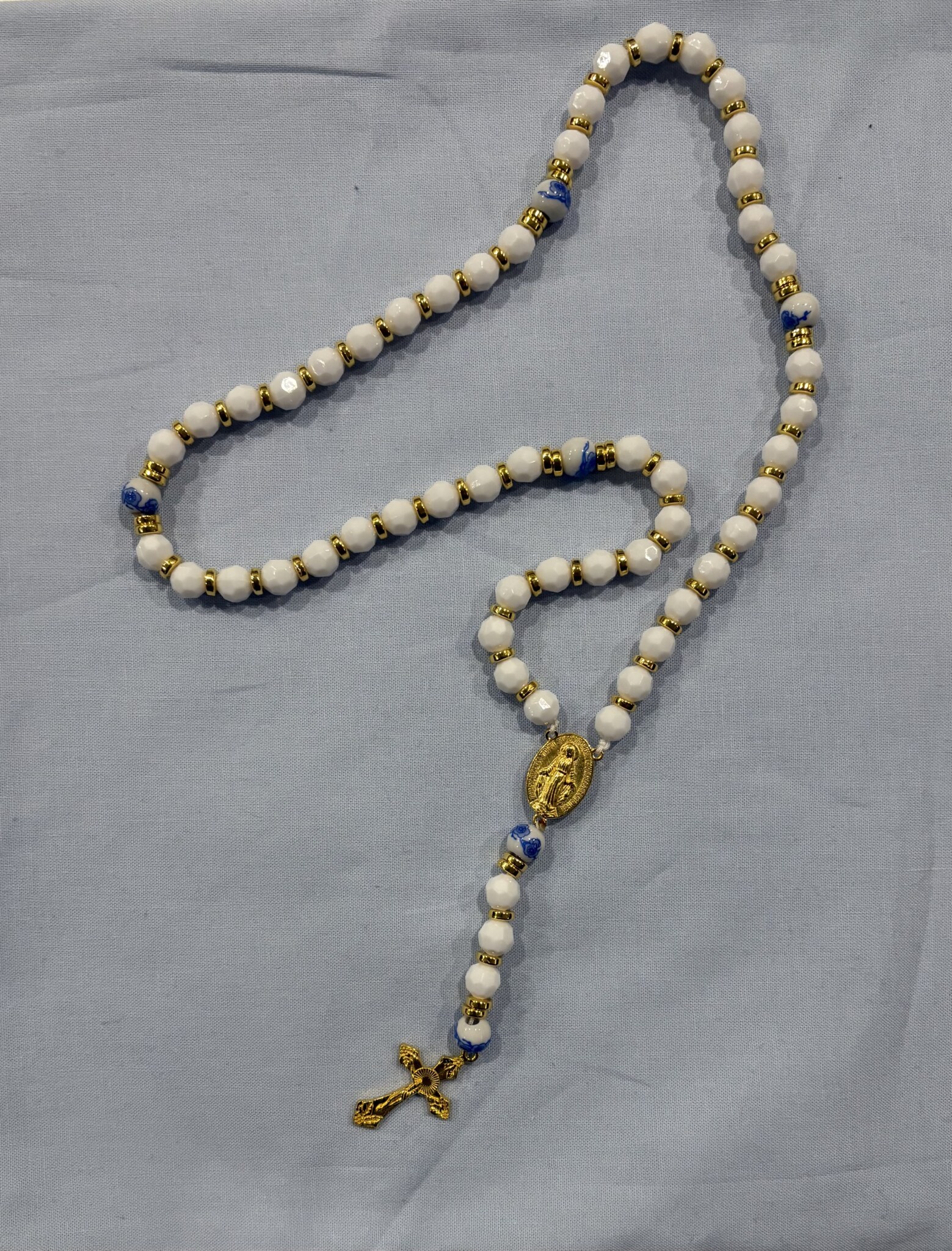 Blue, white and gold rosary | Peter’s Square